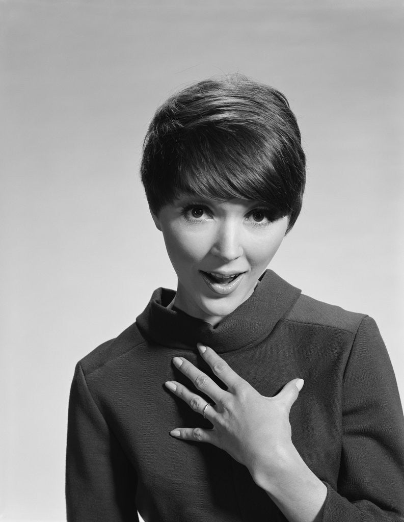 Brunette woman hand to chest questioning quizzical express who me ...